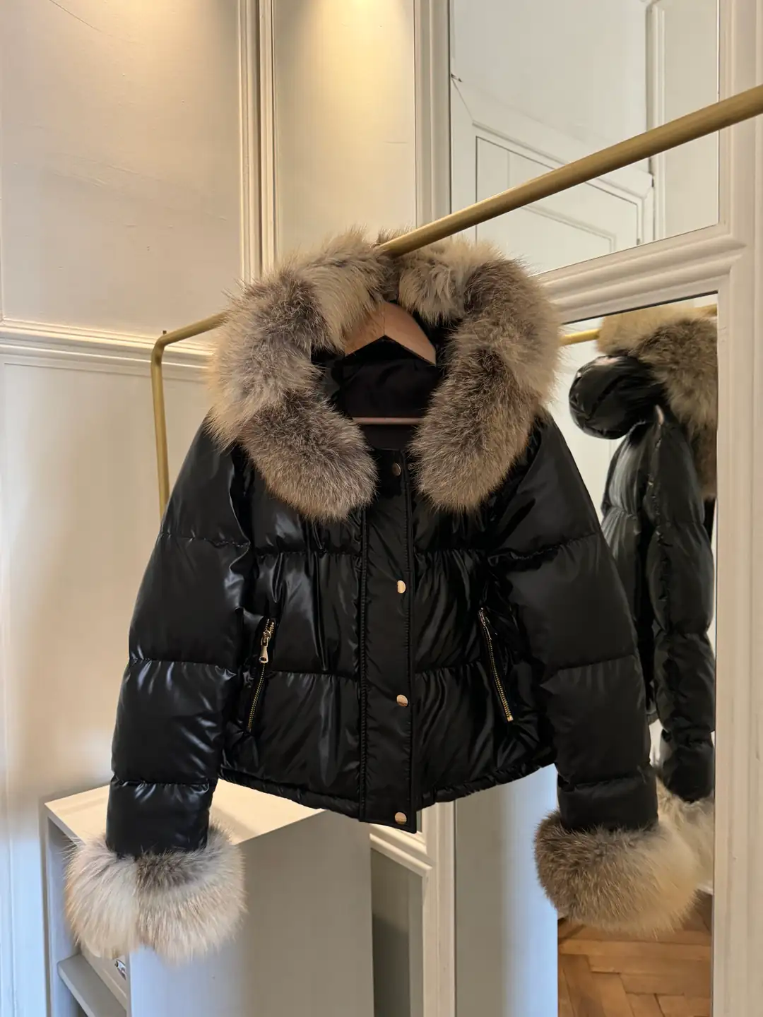 Fox Collar Puffer Jacket. Crafted from down. Features genuine materials.